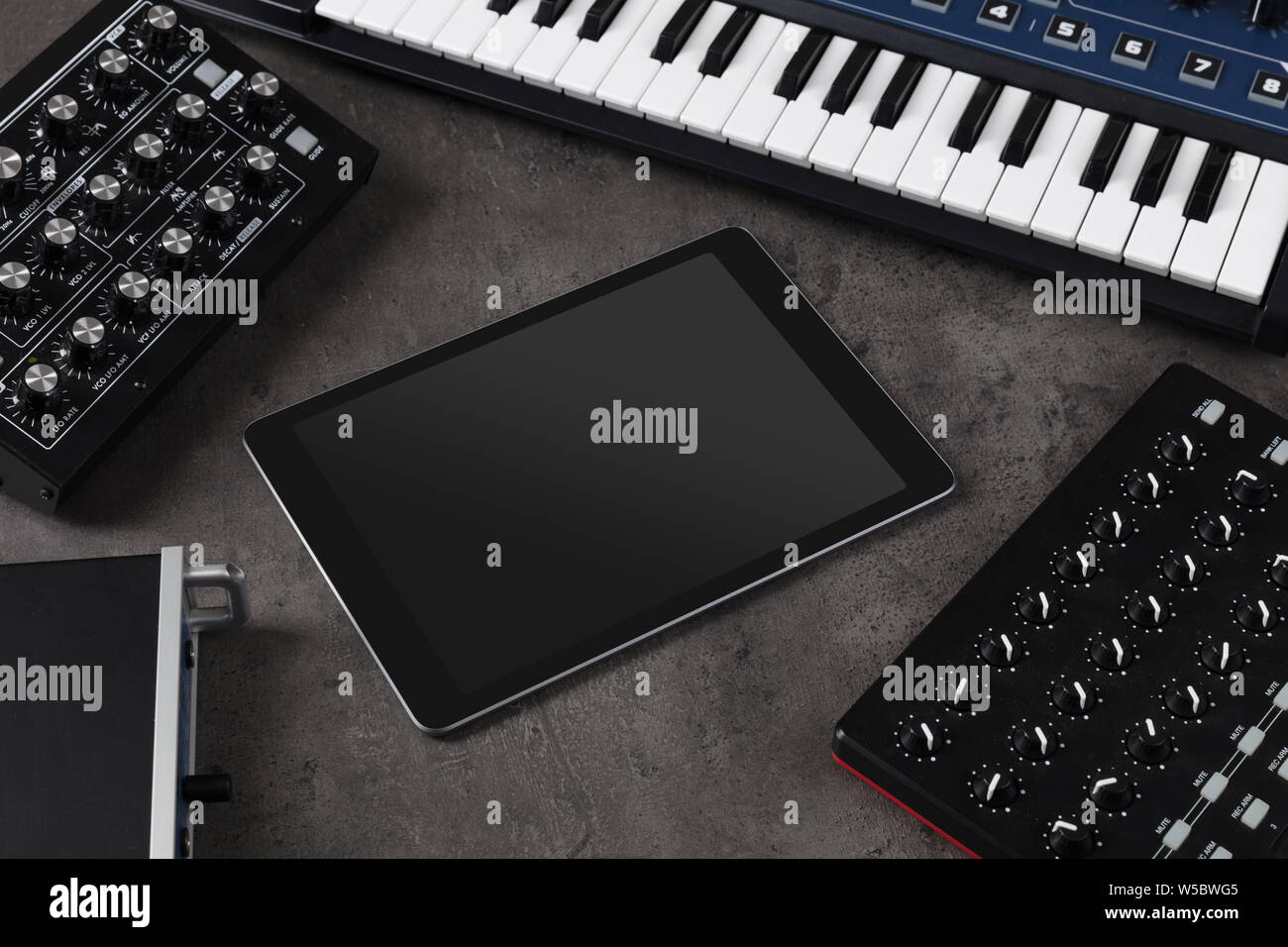 Empty tablet and electronic music instruments Stock Photo - Alamy