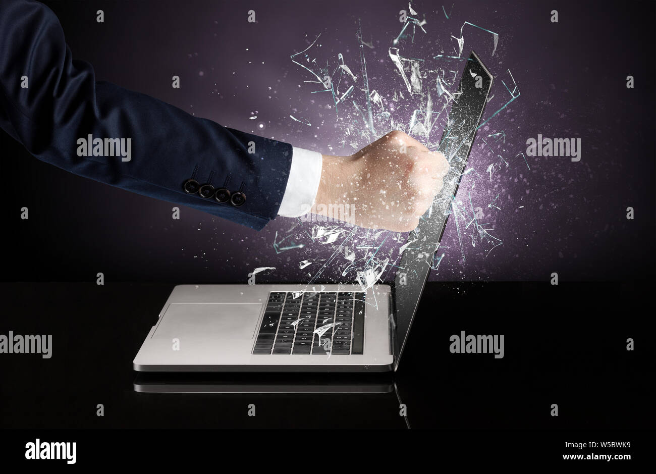Hand hitting strongly laptop screen glass Stock Photo - Alamy