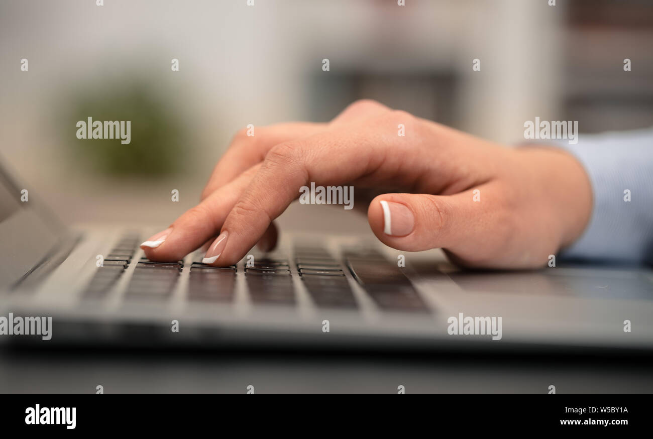 Hand typing on keyboard with office concept Stock Photo - Alamy