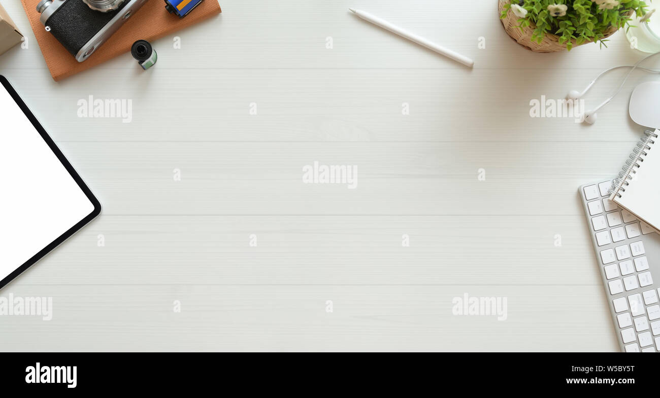 White wood desk table of photographer with vintage camera, laptop ...