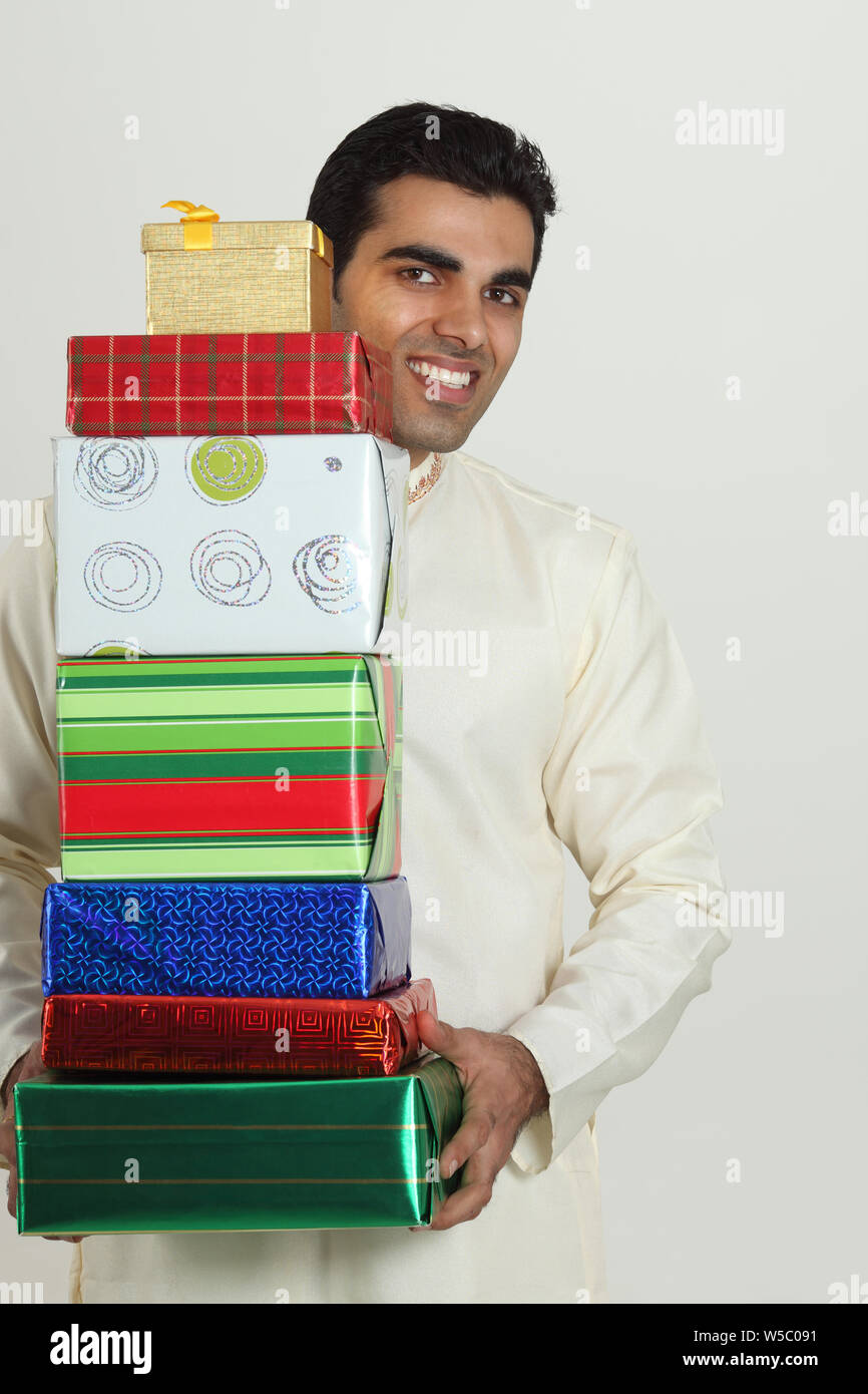 Indian person giving gifts hi-res stock photography and images - Alamy