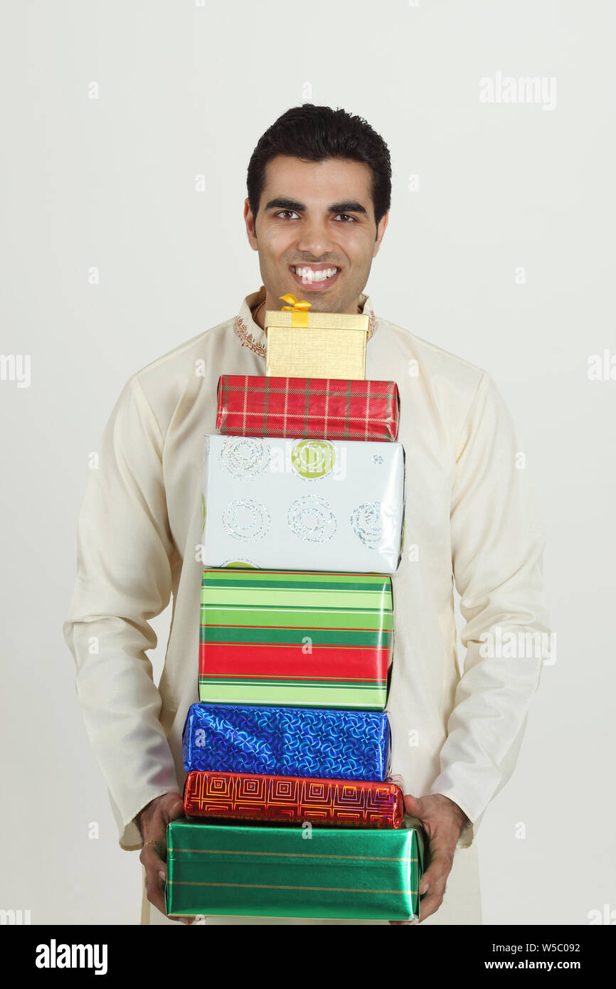 Indian person giving gifts hi-res stock photography and images - Alamy