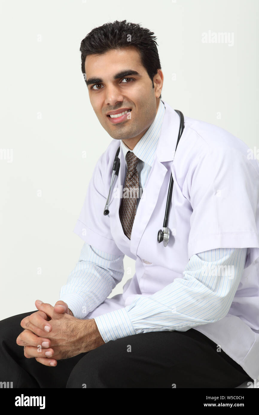Indian male doctor sitting hands hi-res stock photography and images ...