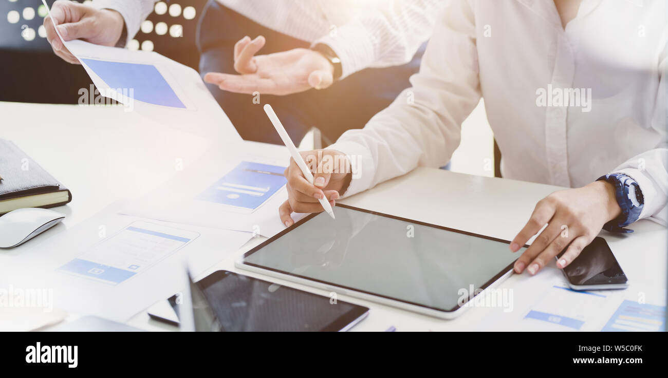 Young professional UI UX developers working on their project while ... Young professional UI UX developers working on their project while ...