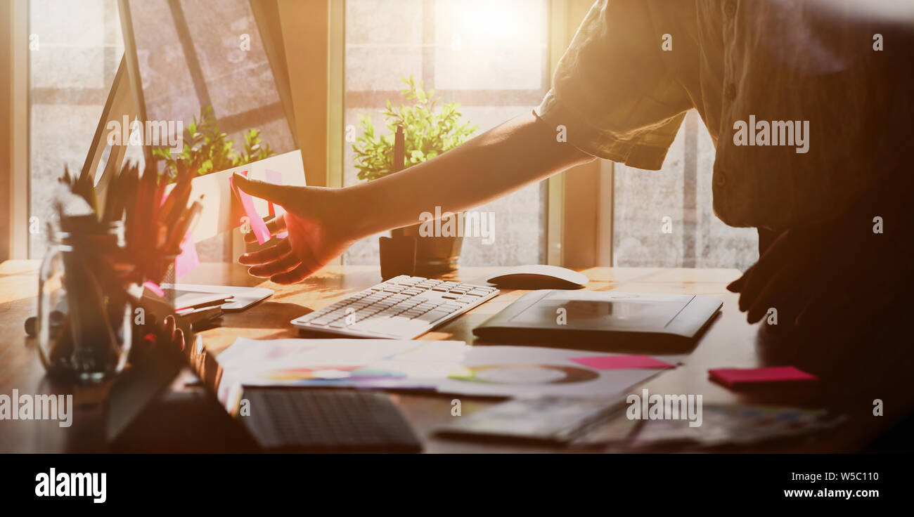 Creative graphic designer planning and thinking of ideas in studio ...