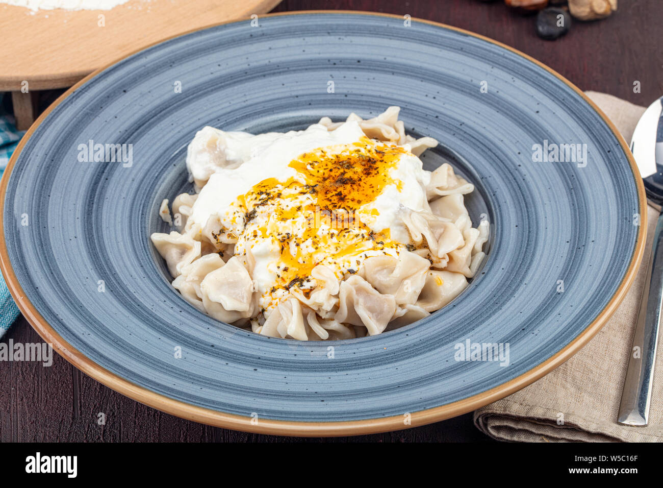 homemade delicious turkish manti ( turkish ravioli ) with yogurt and ...
