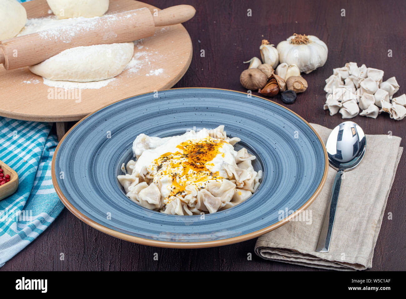 homemade delicious turkish manti ( turkish ravioli ) with yogurt and ...