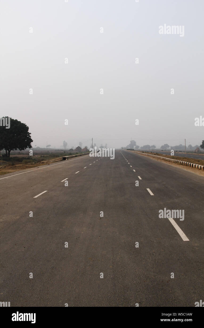 Road passing through a landscape, India Stock Photo - Alamy