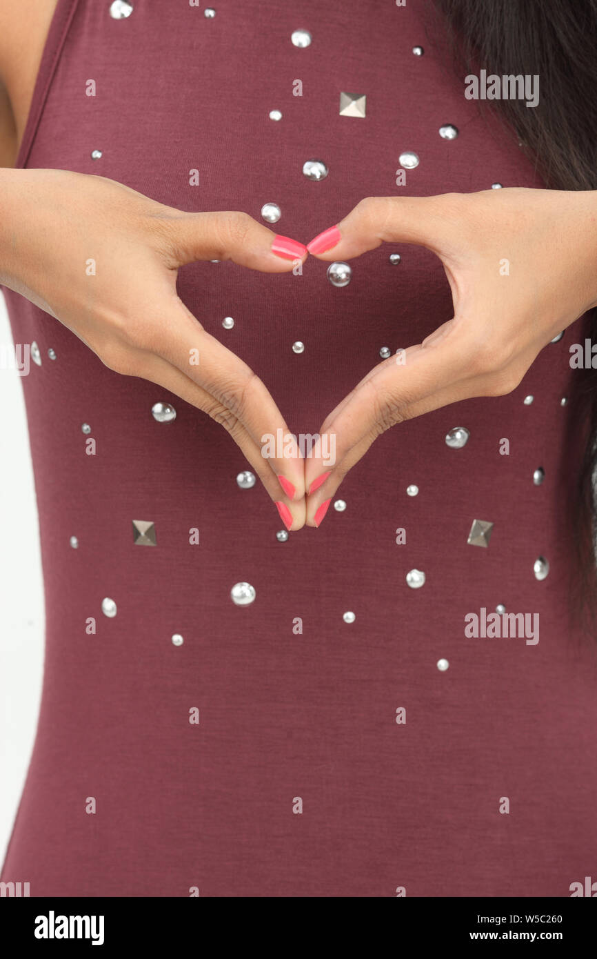 Indian woman making heart shape with his hands Stock Photo - Alamy