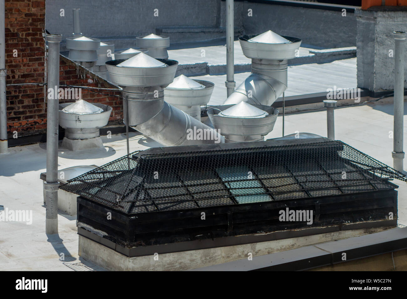 New York city silver rooftop vents and ducts with bared in skylight ...