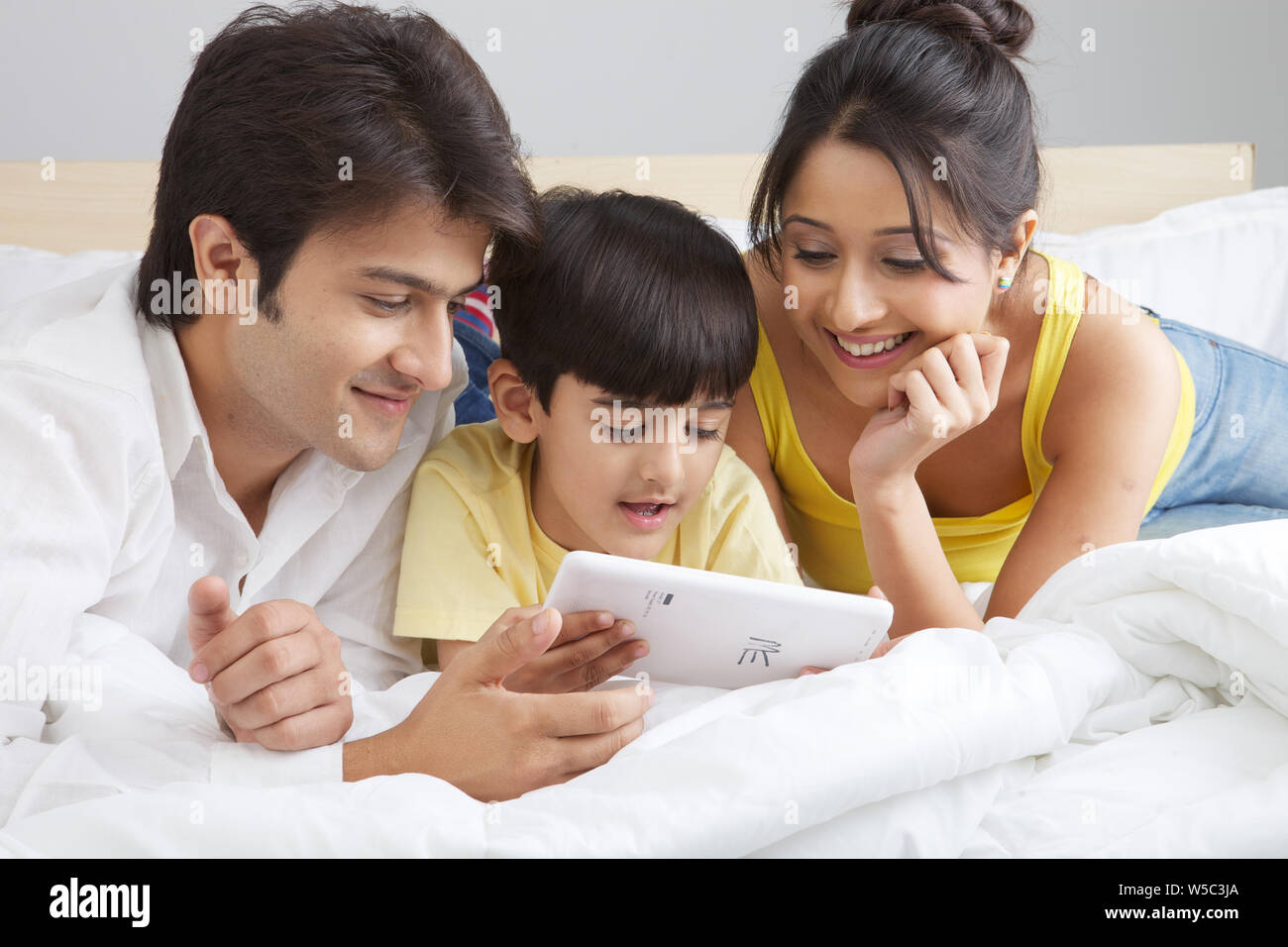 Indian family mobile tablet hi-res stock photography and images - Alamy