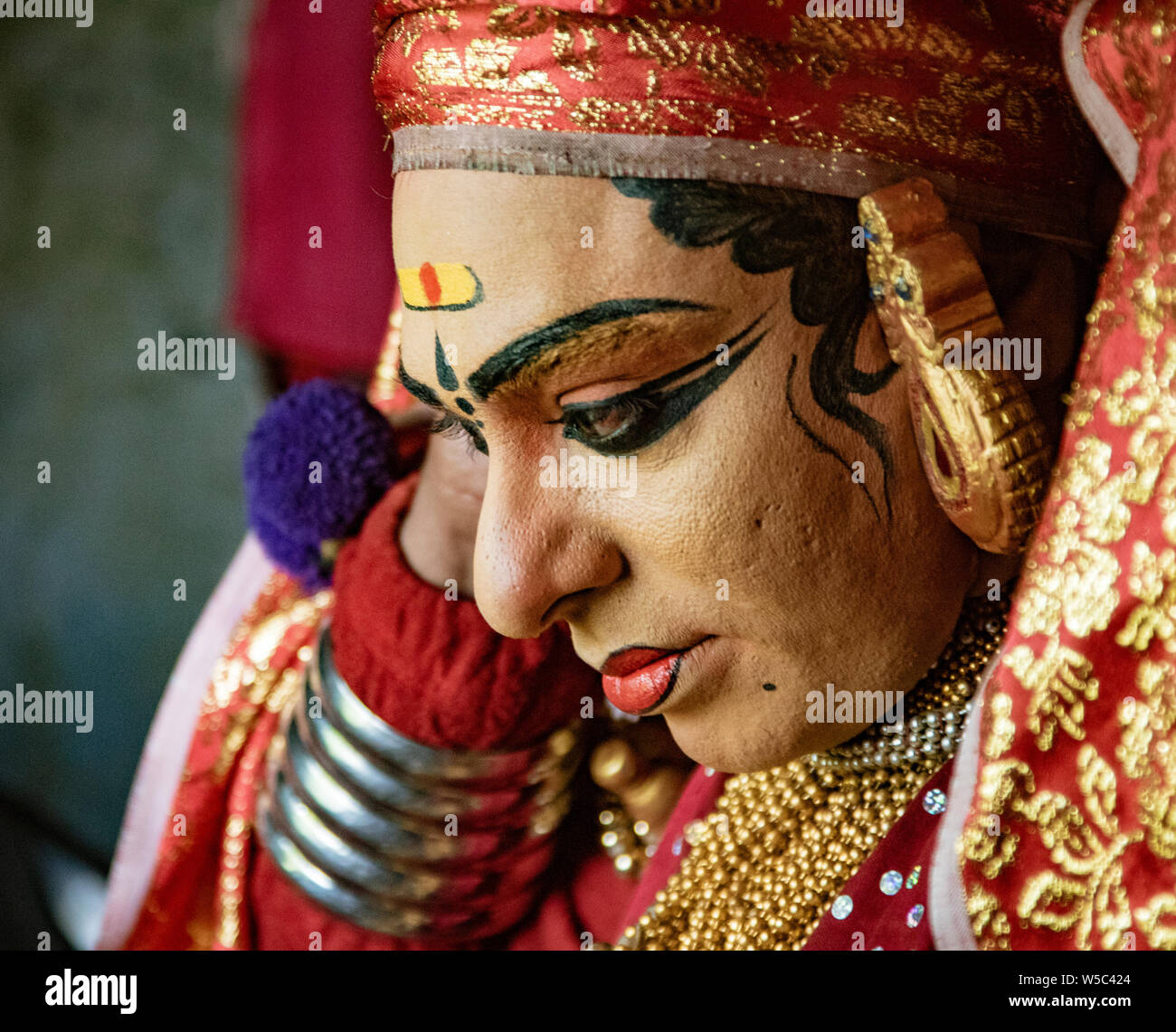 Munnar, India, Mar 11, 2018 - Traditional Indian dancer adjusts his ...