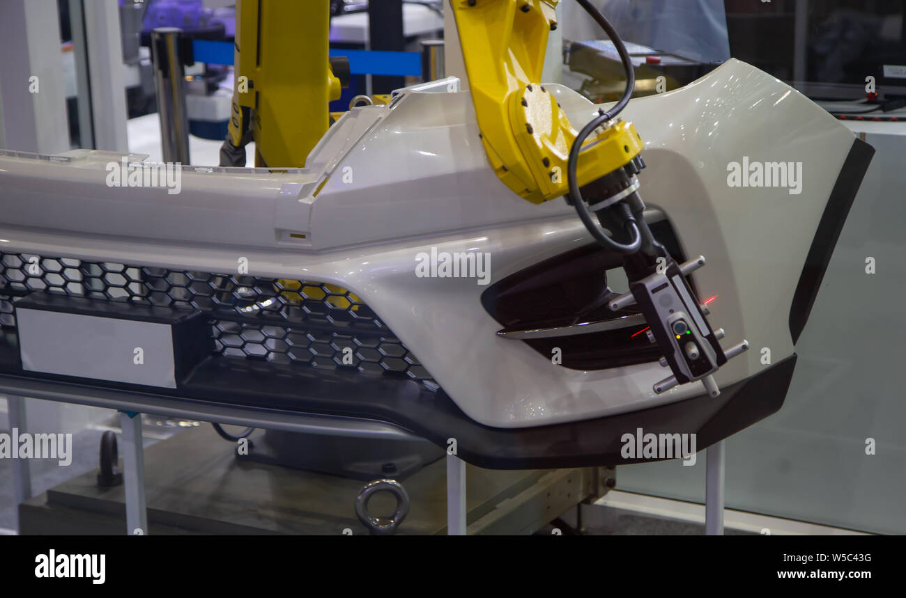 Automated robotic arm CMM scanning in automotive industry Stock Photo ...
