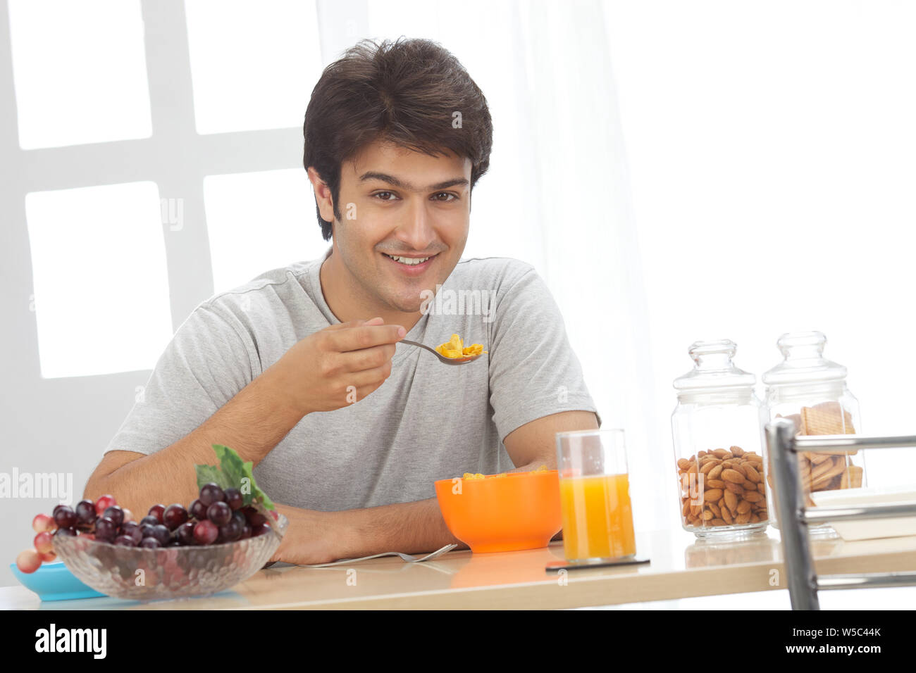 Man having breakfast Stock Photo - Alamy