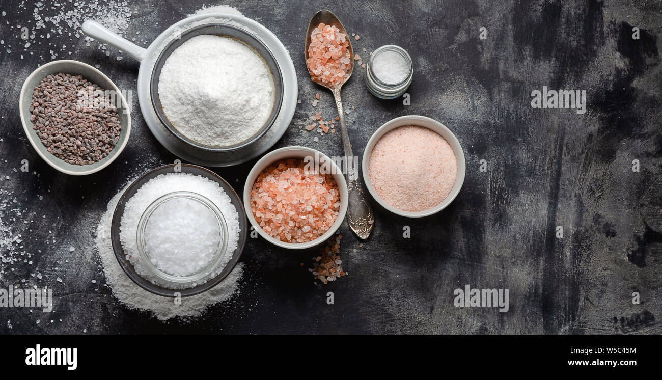 Types of salt on black background. Top view with copy space. Panorama ...