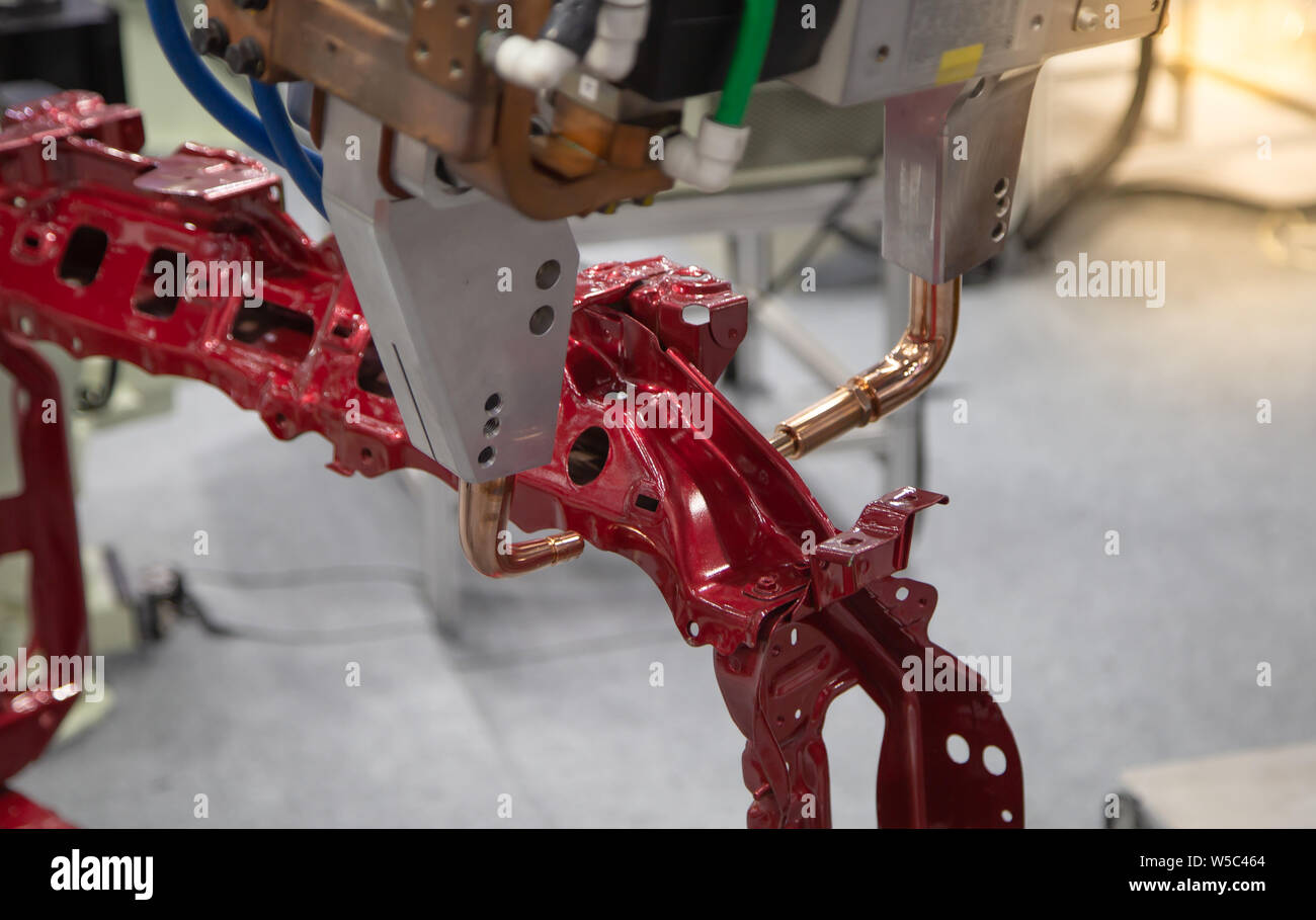 Automated robotic arm spot welding in automotive industry Stock Photo ...