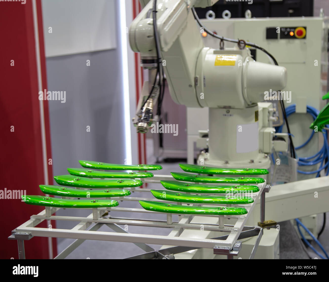 Robotic arm painting motorcycle parts in automotive industry Stock ...