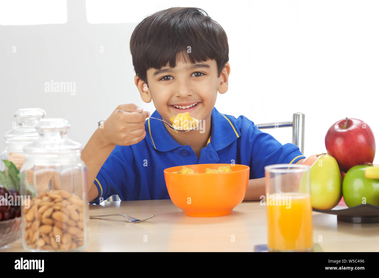 Boy having breakfast Stock Photo - Alamy