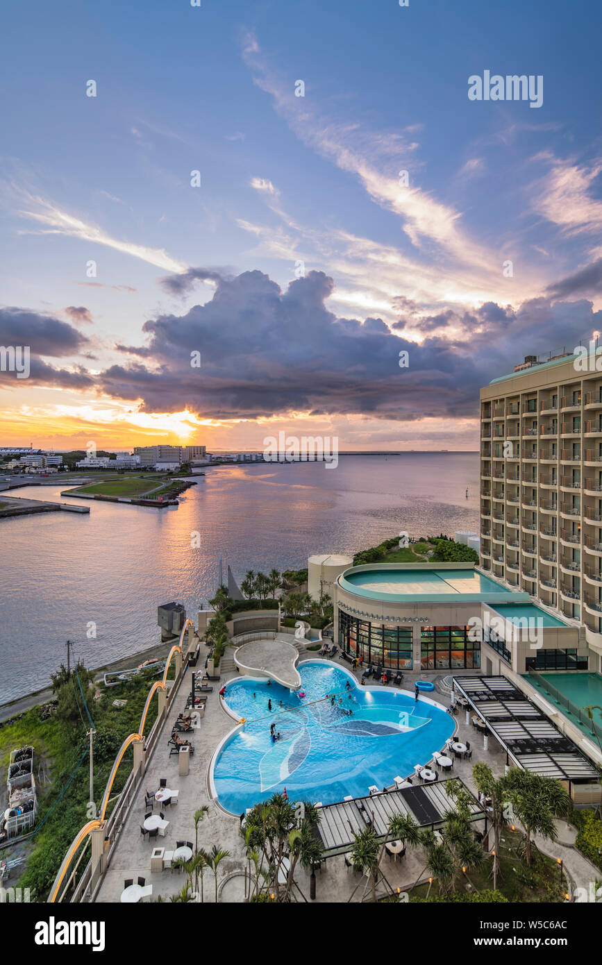Sunset over the butterfly-shaped swimming pool of Loisir Hotel and the ...