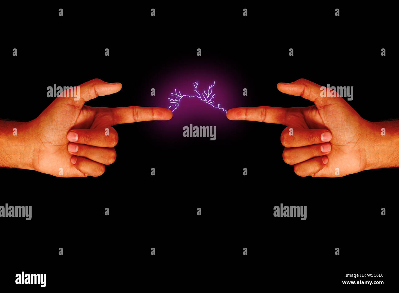 Two hands in contact with bright flash Stock Photo - Alamy