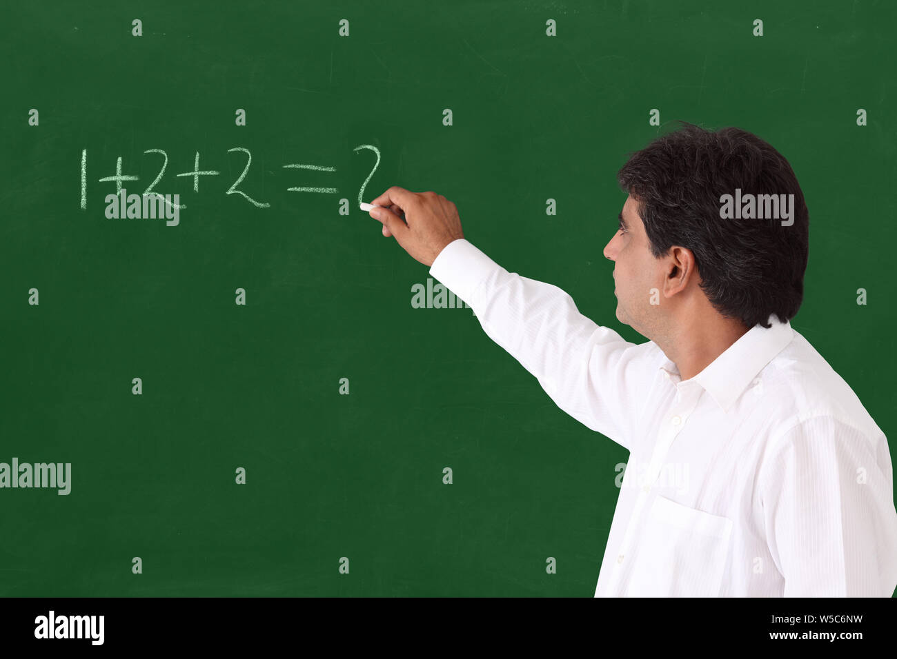 Teacher teaching in a classroom Stock Photo - Alamy