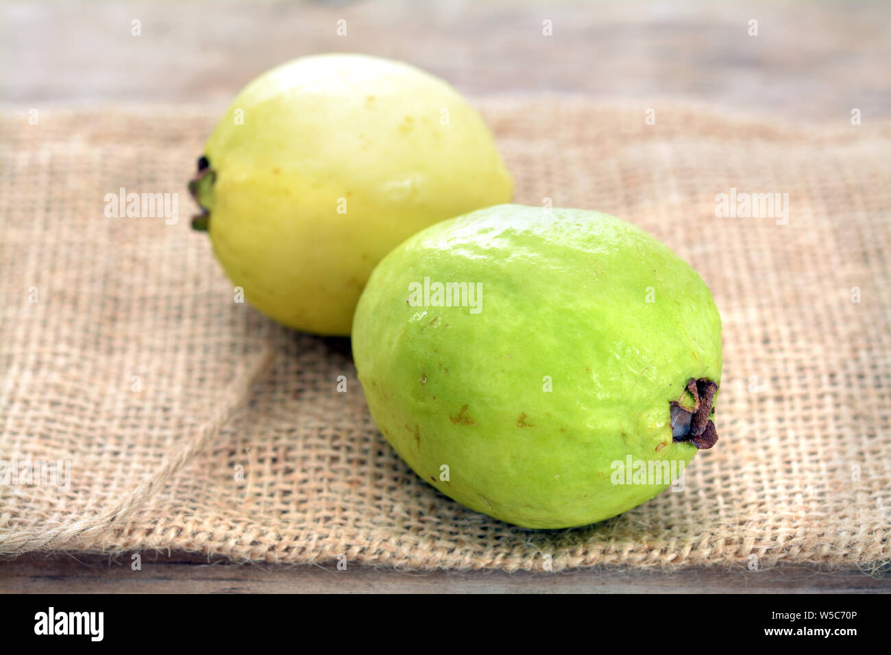 two delicious guava fruit on the table Stock Photo - Alamy
