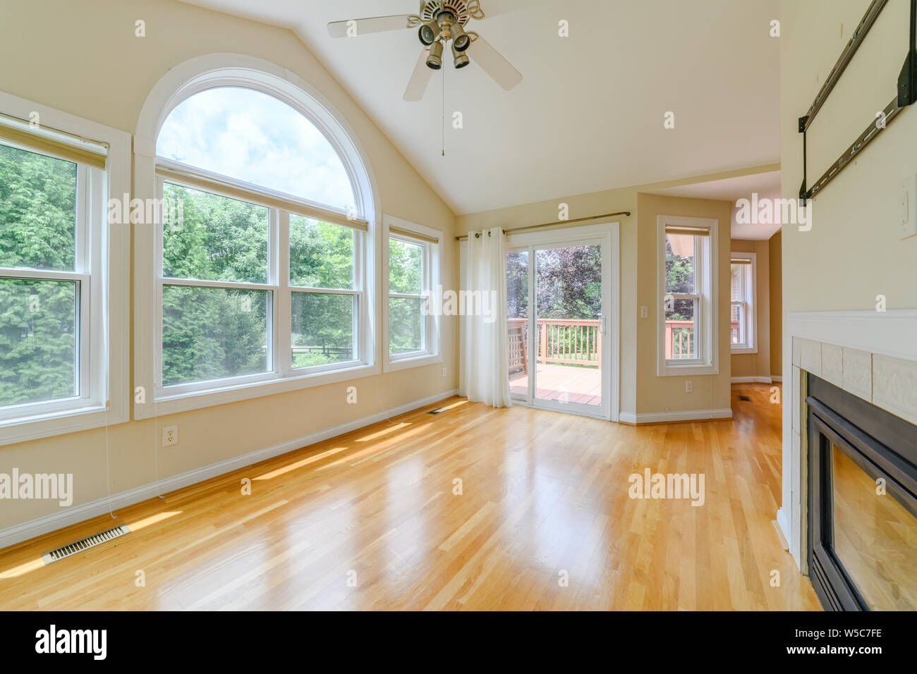 A empty undecorated dining room with many windows Stock Photo - Alamy