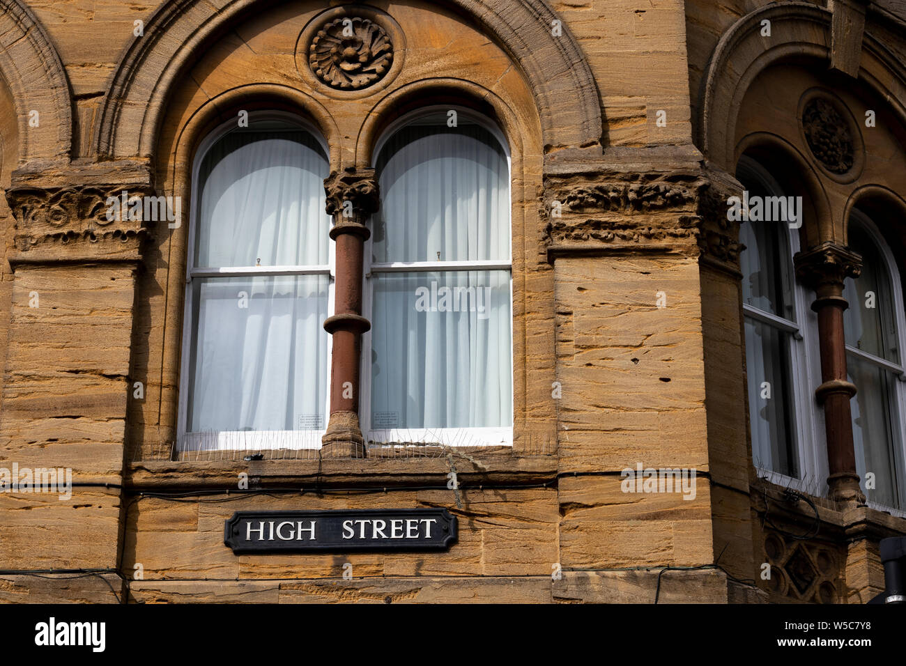 High Street road name on historic building in the city centre Stock ...