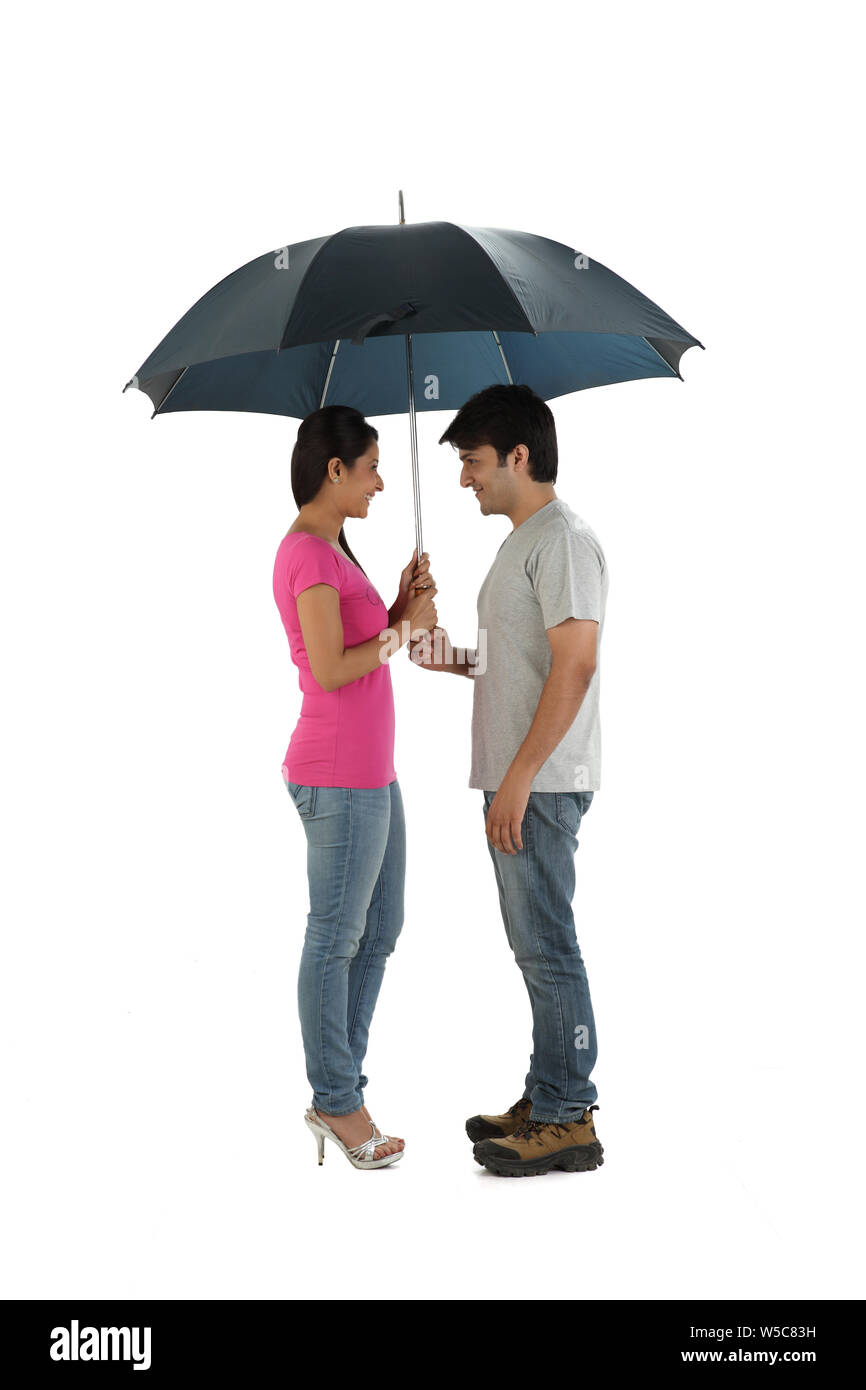 Couple under umbrella Cut Out Stock Images & Pictures - Alamy
