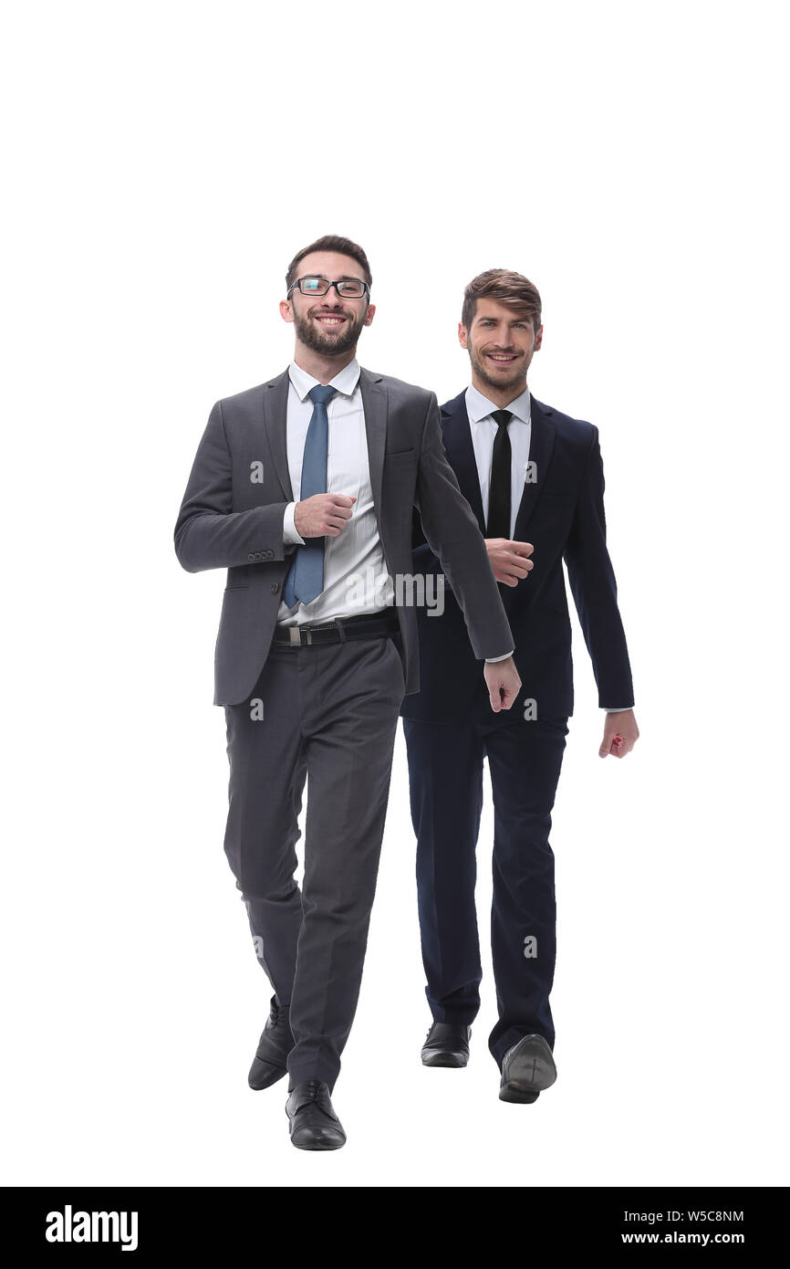 Two young successful businessmen walking hi-res stock photography and ...