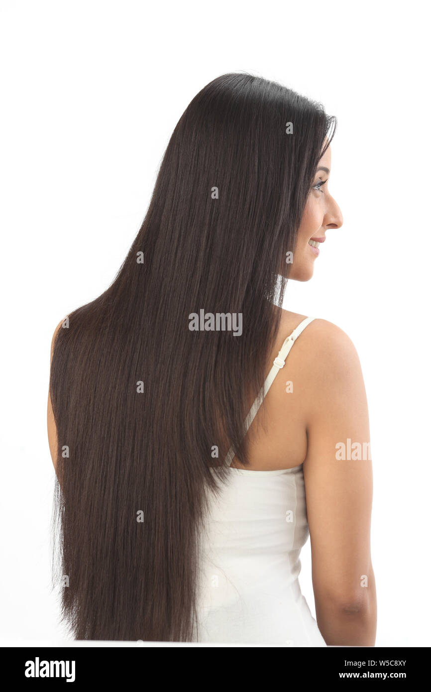 Rear view of a woman showing her straight hair Stock Photo - Alamy