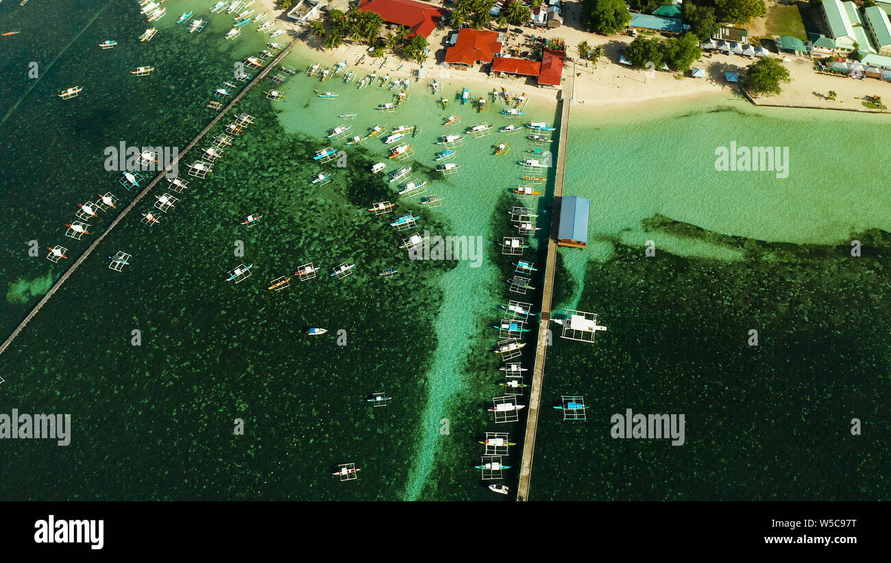 City General Luna on the coast of Siargao with a pier, a port and ...