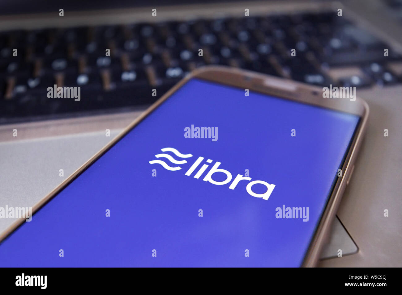 Facebook Cryptocurrency Libra concept with cellphone with Libra and ...