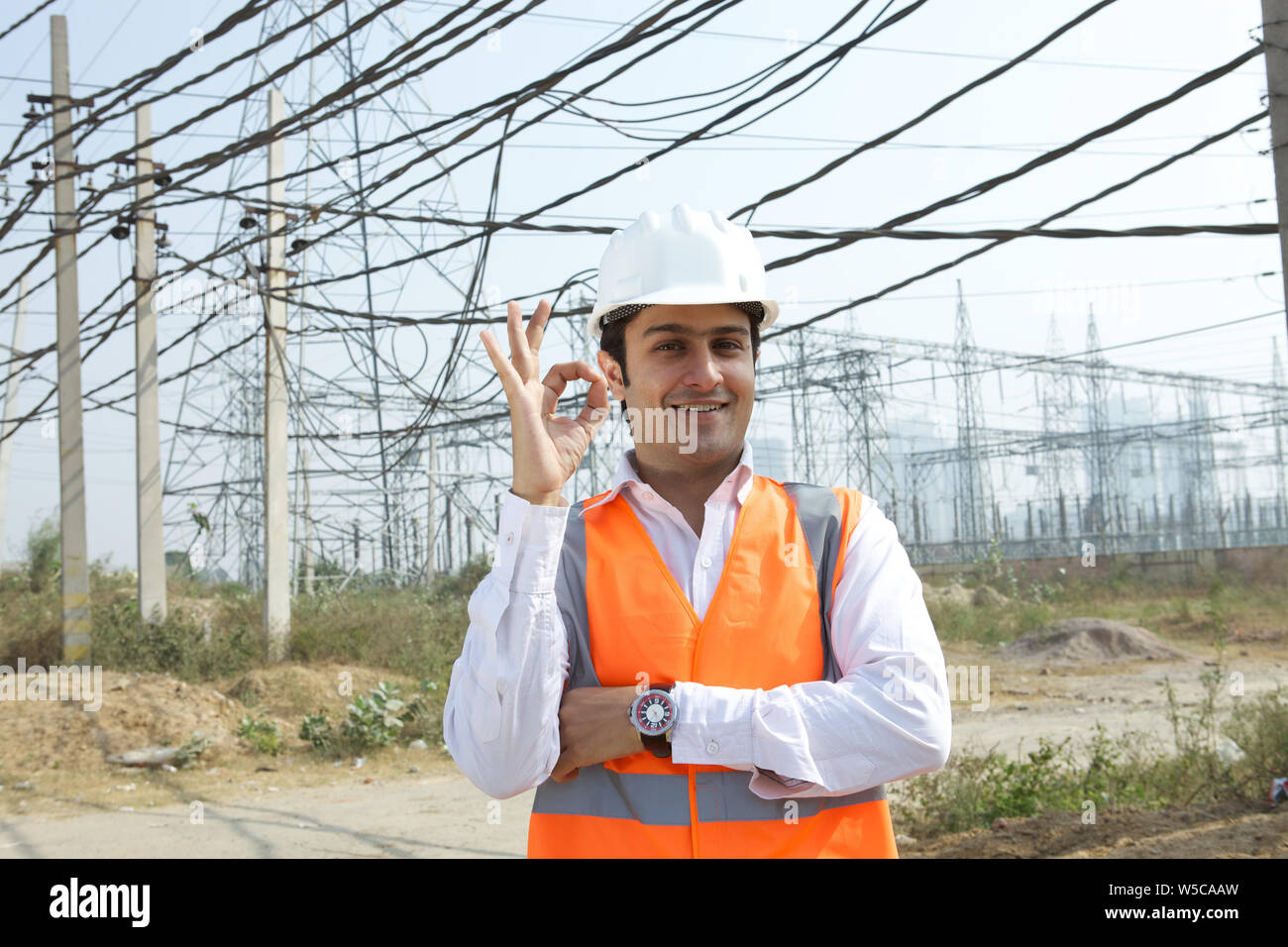 Engineer showing ok sign and smiling Stock Photo - Alamy