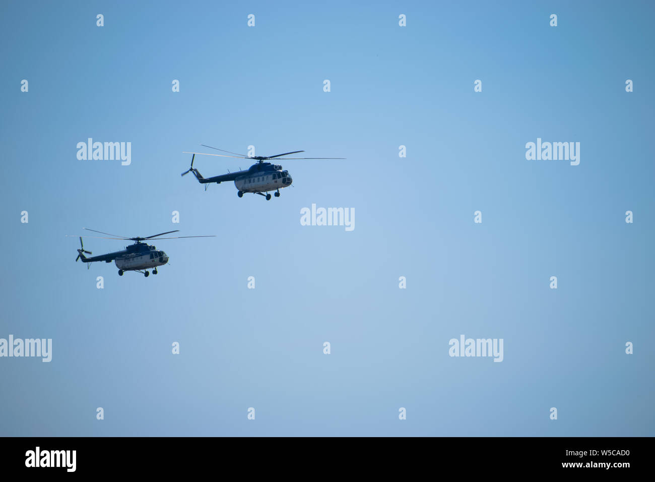 Police helicopters flying on the blue sky - Bucharest, Romania Stock ...