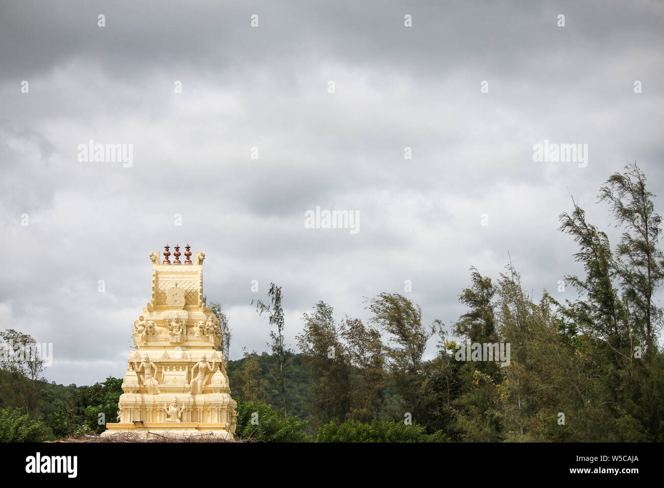 Temple tower along the mountain range of Talamalai Reserve Forest, Hasanur, Tamil Nadu ...