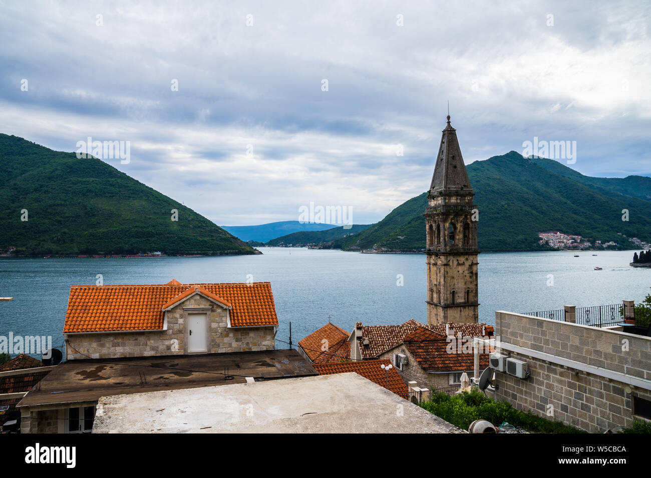 Montenegro, Ancient typical old town of perast village and church spire ...