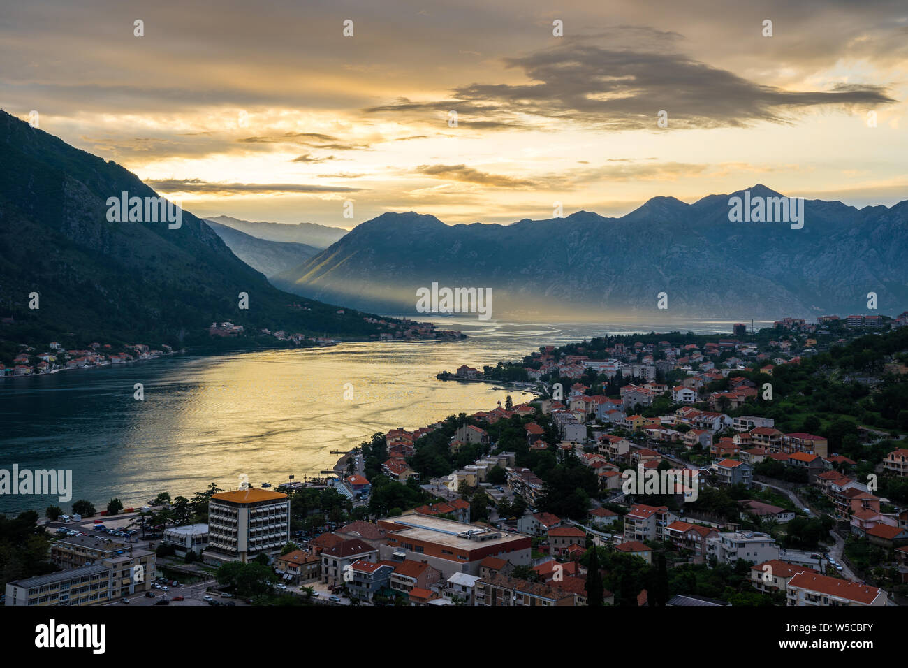 Montenegro, Spectacular light beam of sunset twilight shining between ...