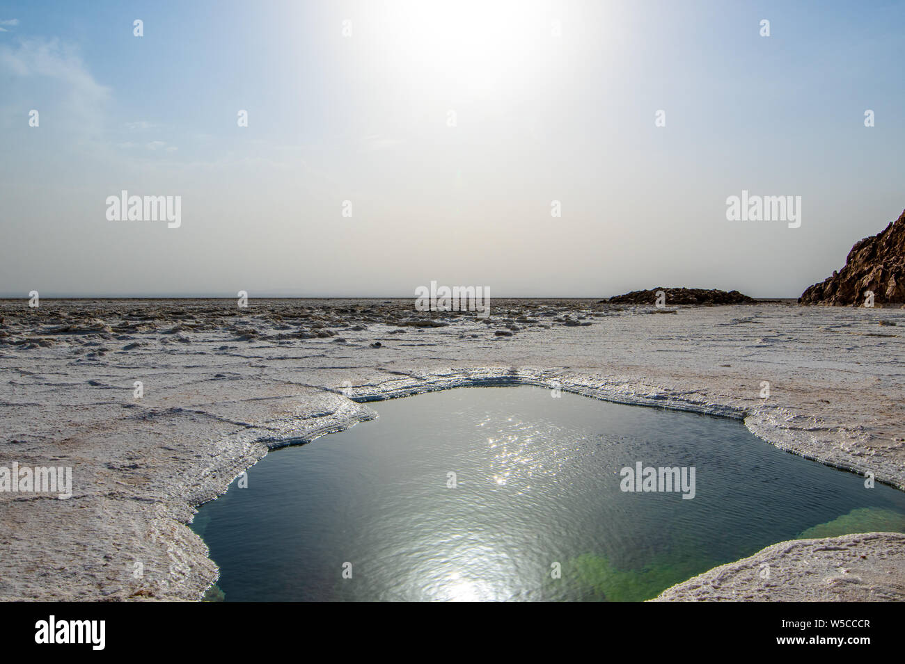 Water of Lake Karum, visible through a hole in the salt flat, Danakil ...