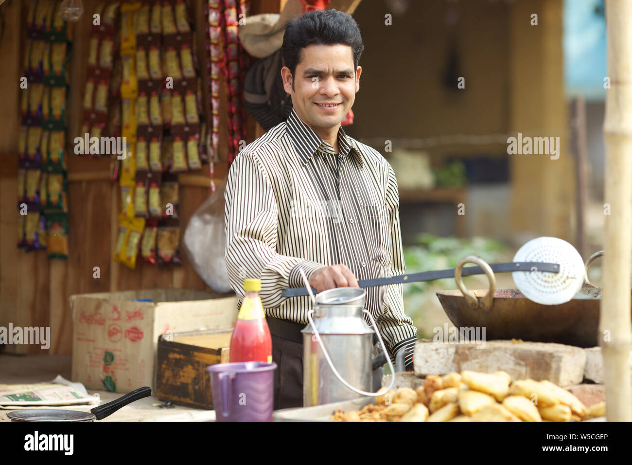 Man preparing food at a stall Stock Photo - Alamy
