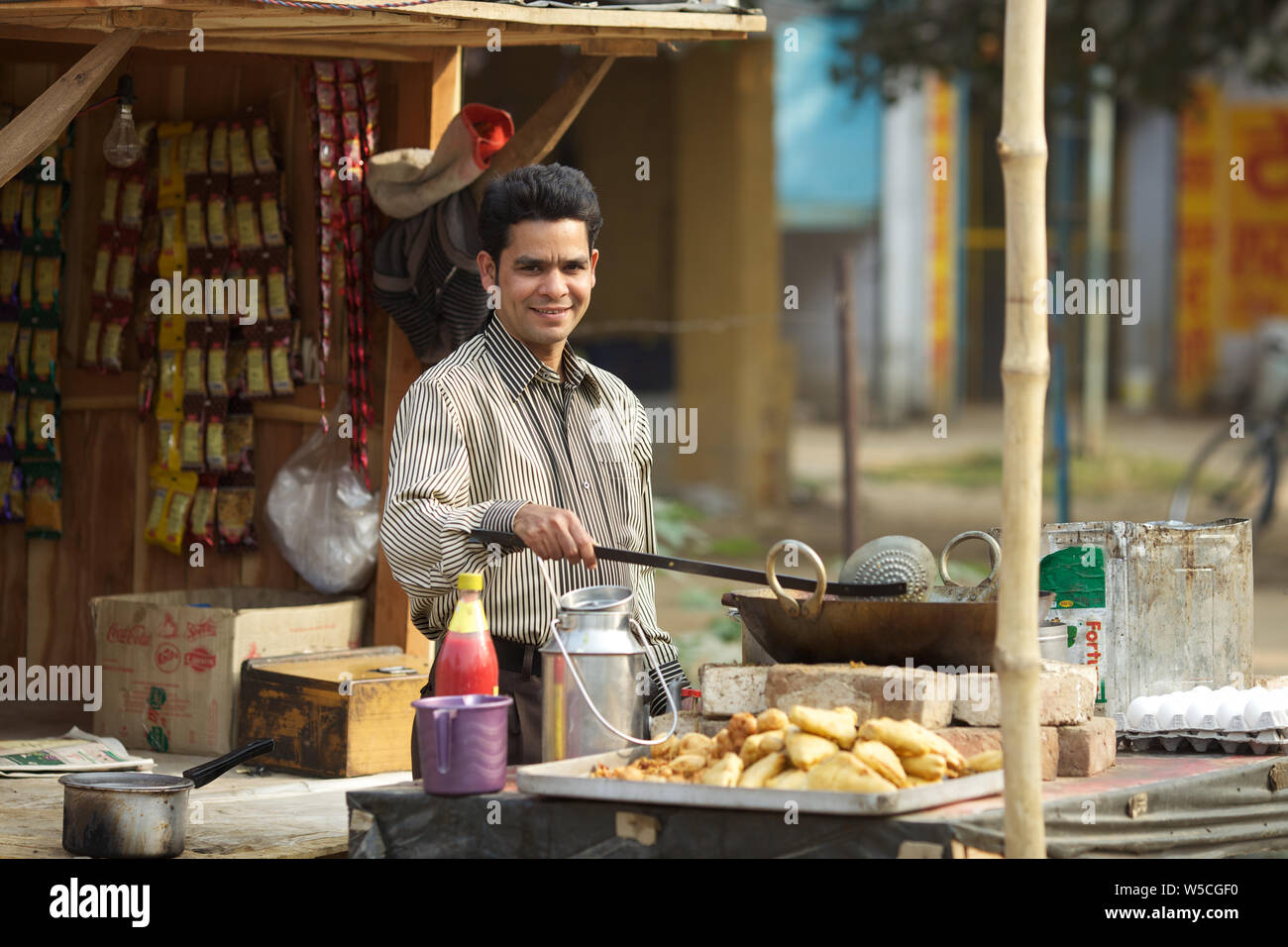 Man preparing food at a stall Stock Photo - Alamy