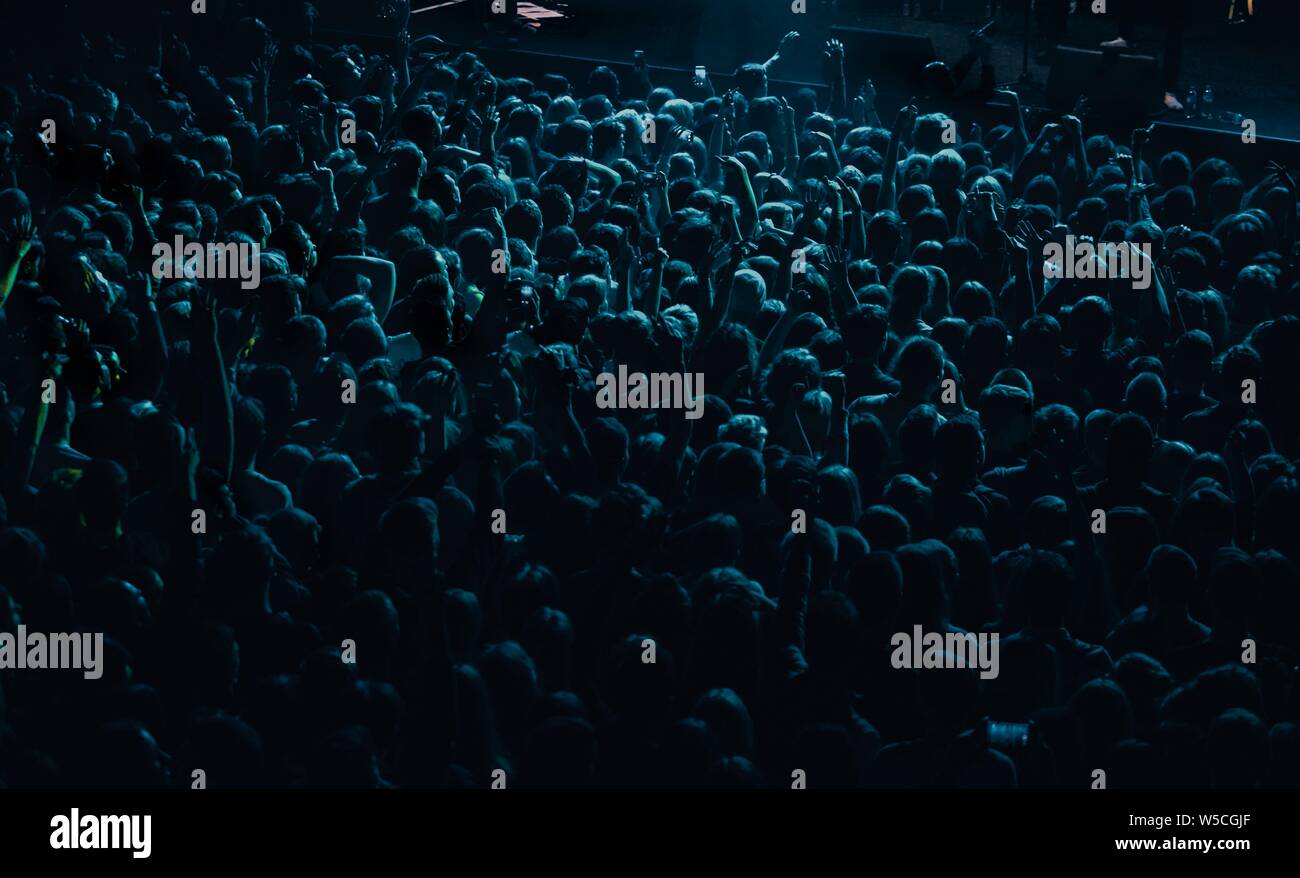 Huge concert crowd shot from above on music festival in nightclub.Big ...
