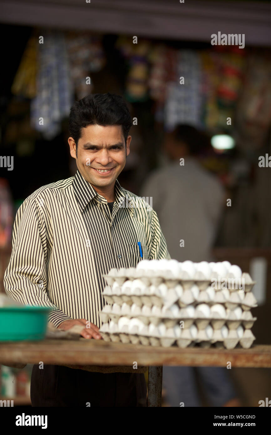 Egg seller selling egg at market stall Stock Photo - Alamy