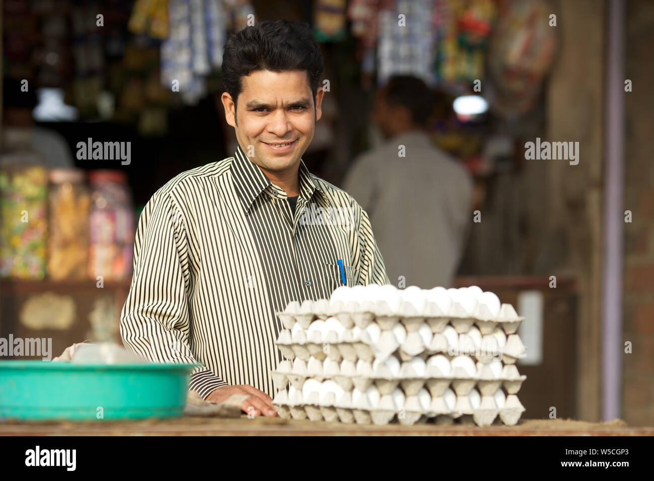 Egg seller selling egg at market stall Stock Photo - Alamy