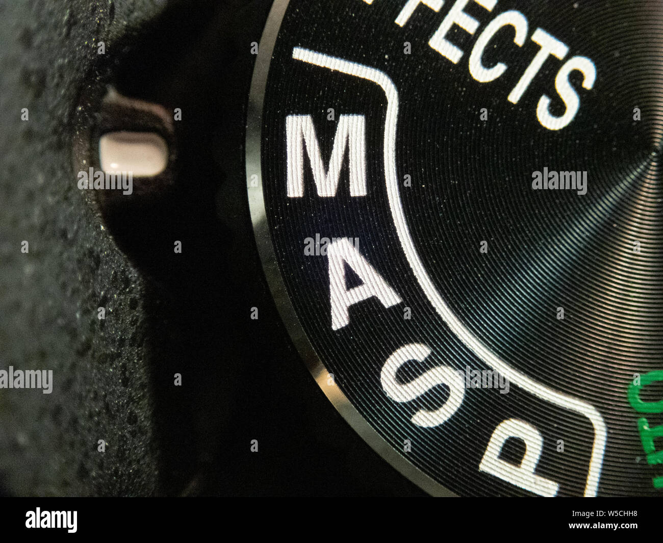 Macro of a Nikon DSLR camera mode dial turned on manual mode Stock ...