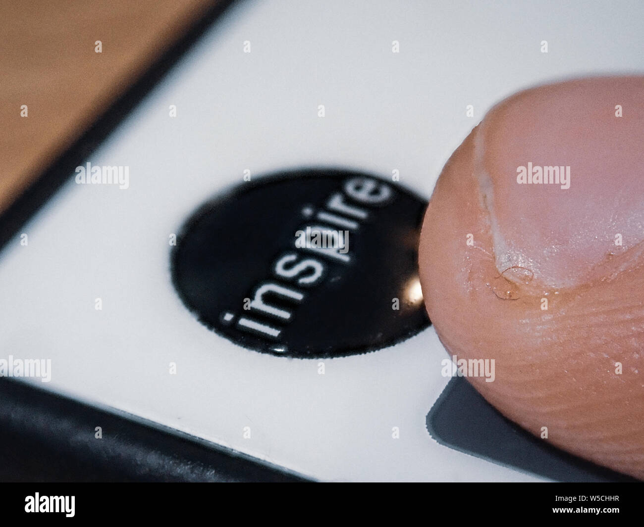 Macro photo of a person pressing an "Inspire" button, Inspirational ...