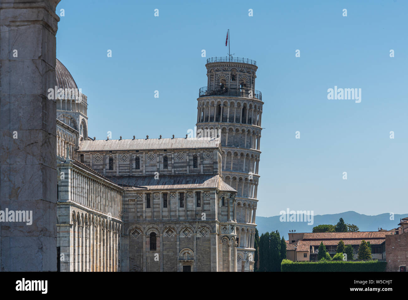 the Leaning Tower of Pisa and the Cathedral of Pisa in front of a ...