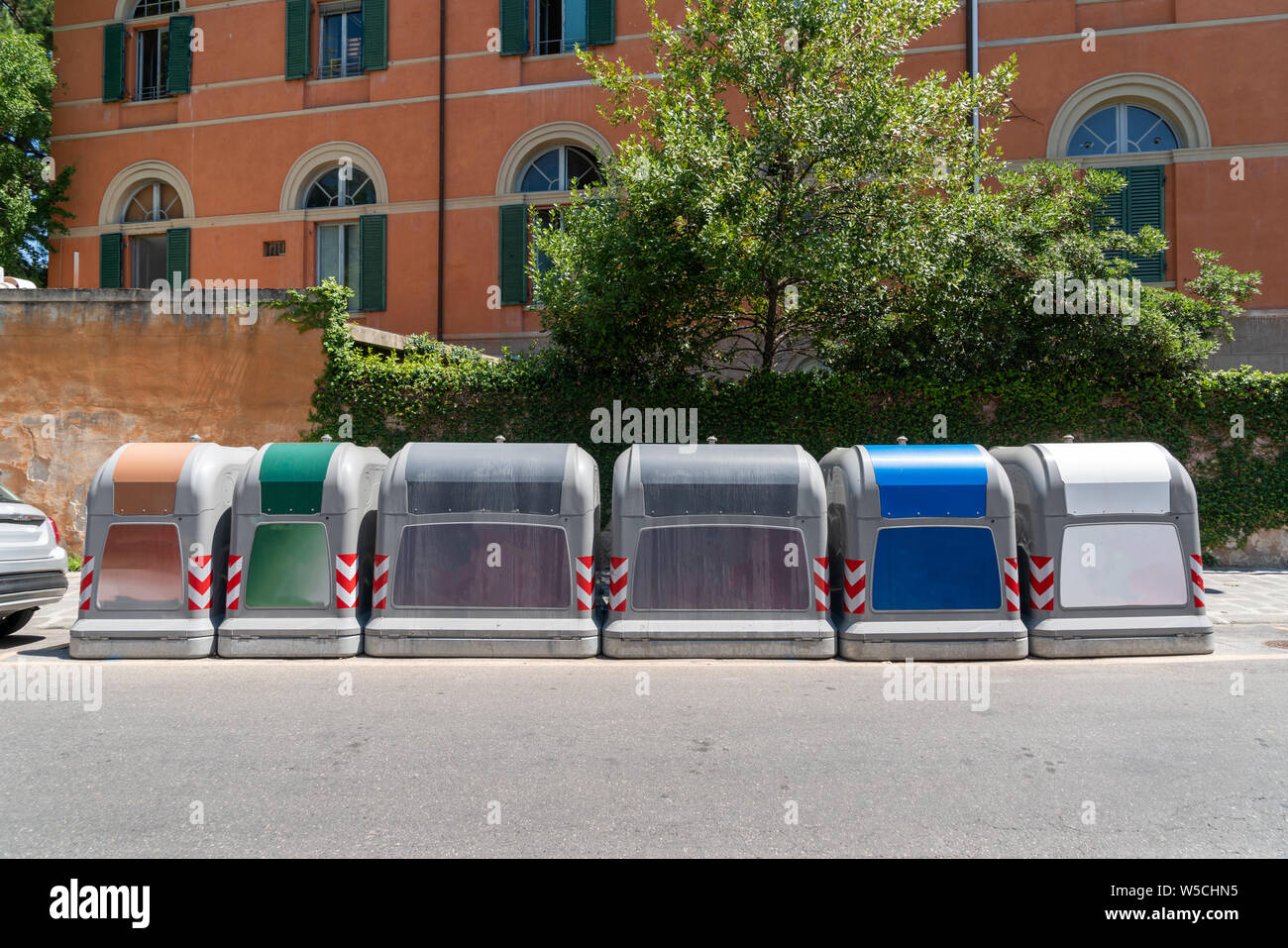 different garbage cans stand at the street in a big city Stock Photo ...