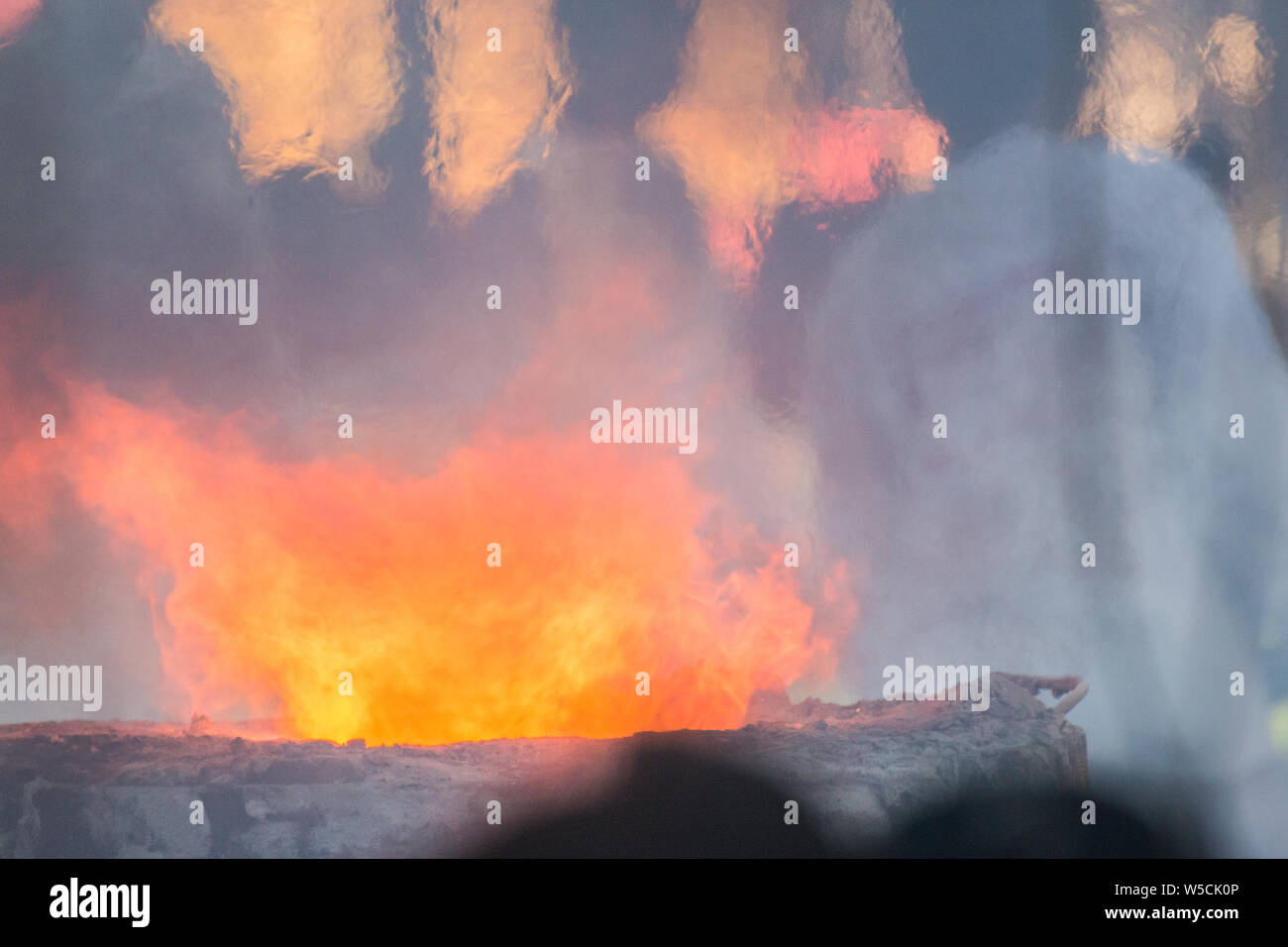 flame during the molten metal, Casting Stock Photo - Alamy