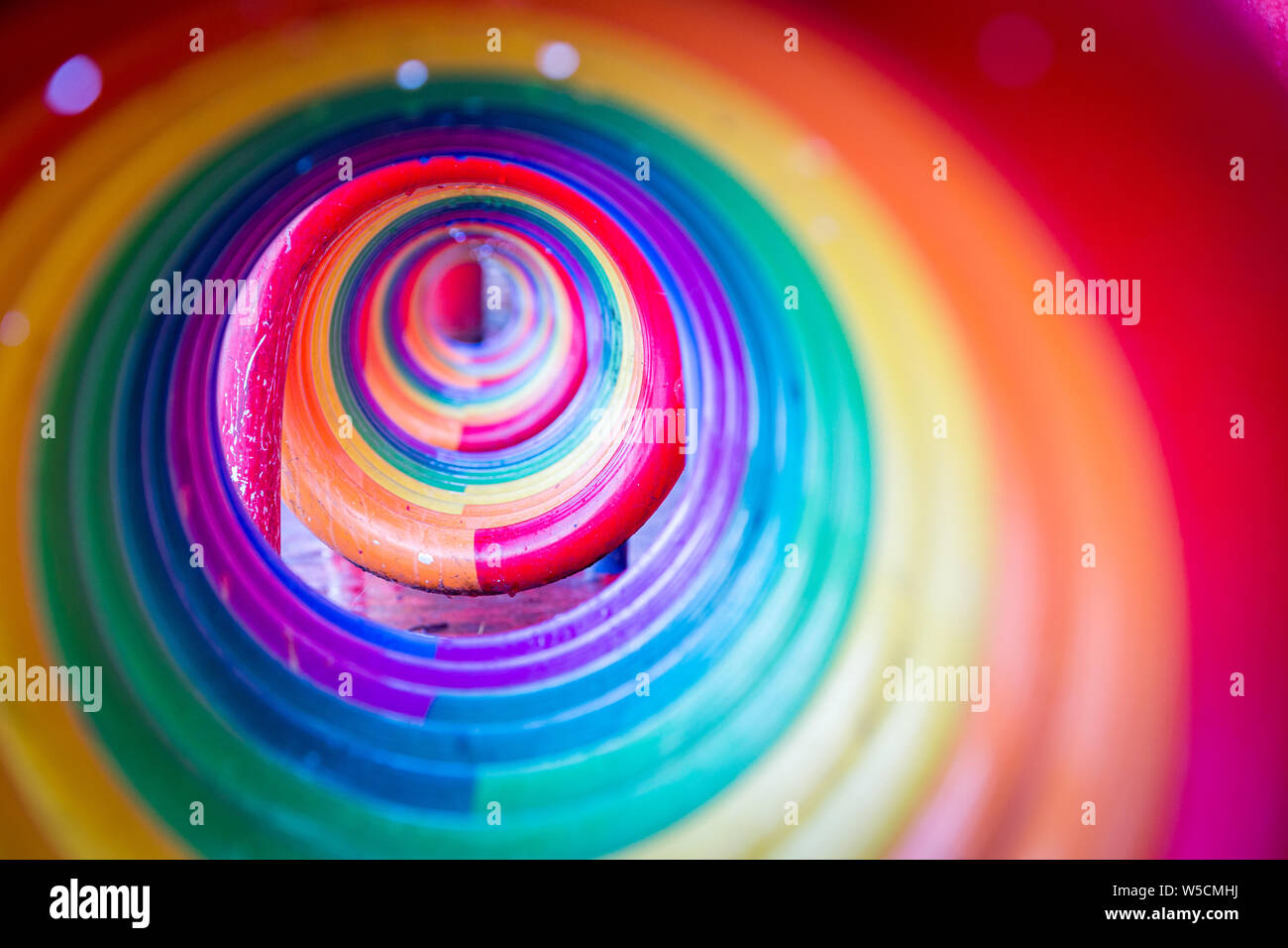 Rainbow colored iron spiral Stock Photo - Alamy